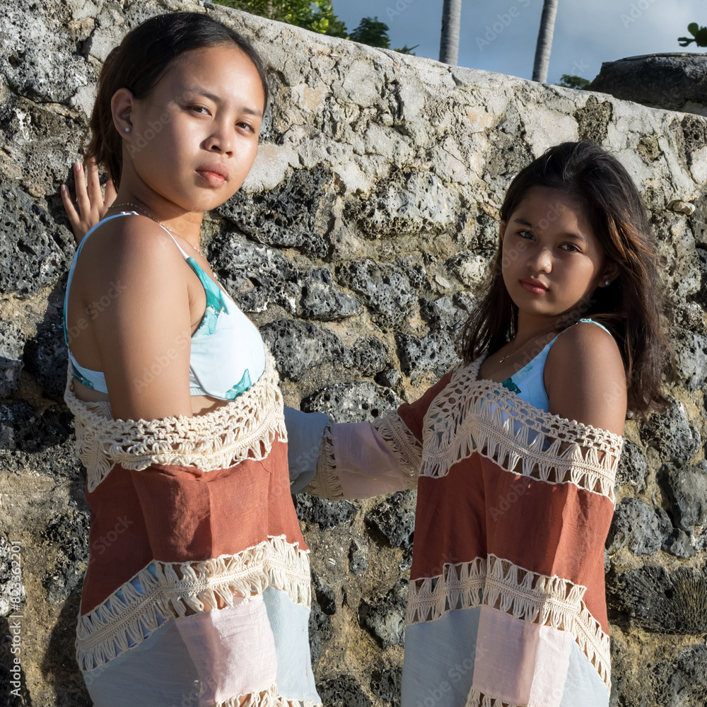 Southeast Asian girls posing in swimsuits with coverups Stock Photo ...
