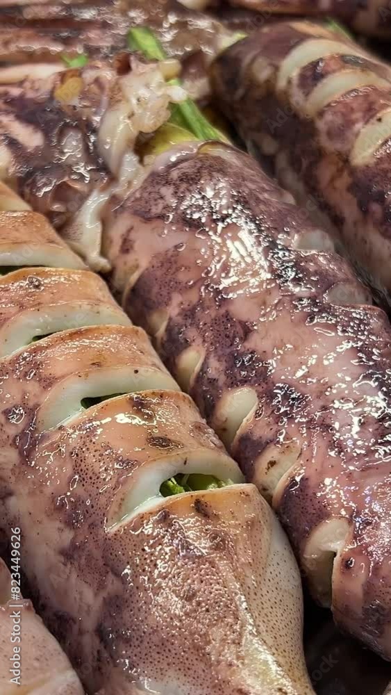 Octopus sashimi in luxury seafood restaurant. Sliced thin fresh cooked ...