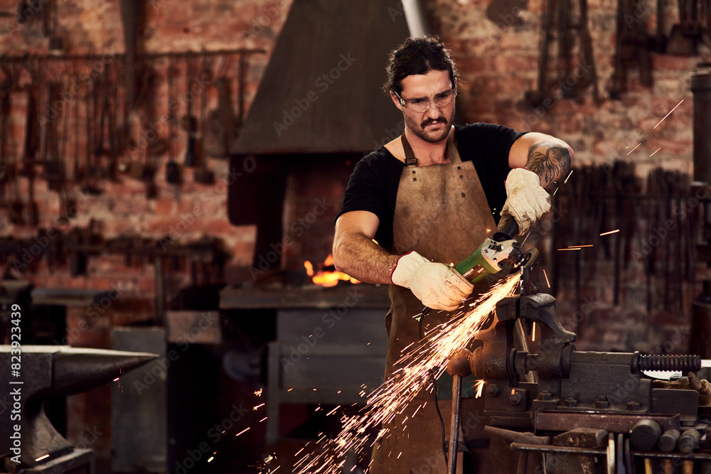 Blacksmith, metal worker or man in workshop and sparks, manual labor ...