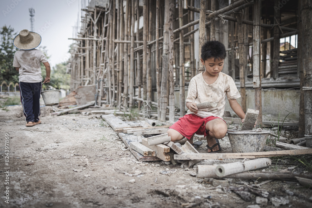 Two poor children are forced to work in construction. Poor children ...