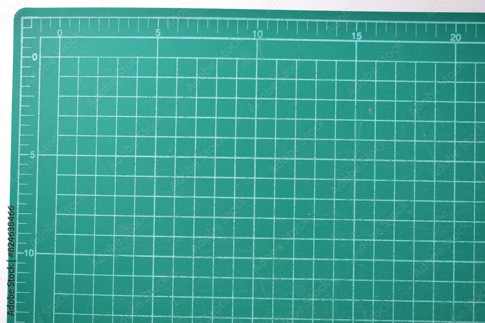 green cutting mat board on white background with line and scale measure ...