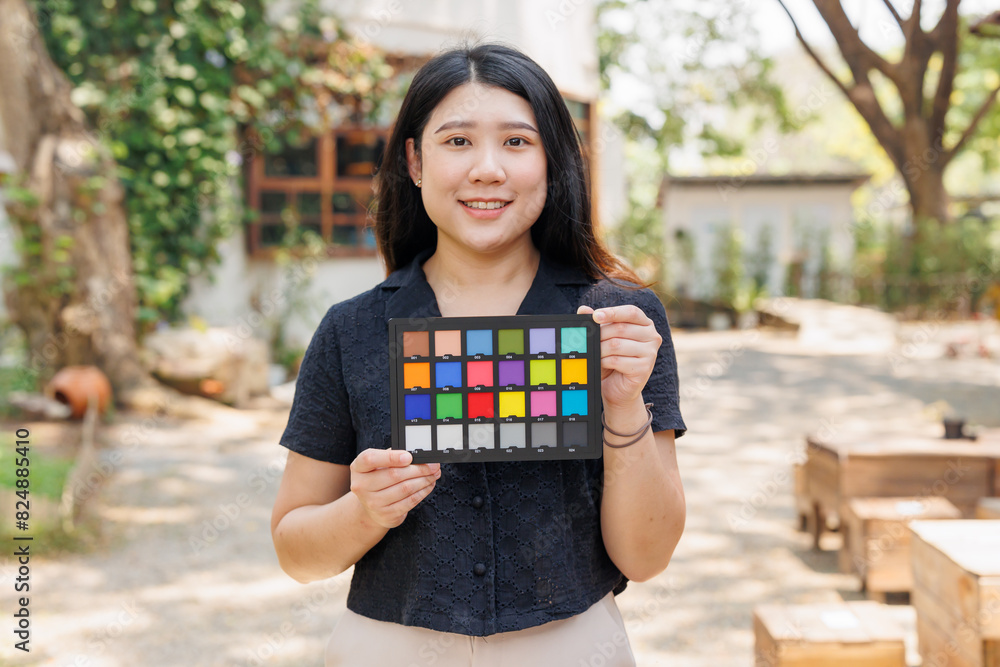 Model holding colors checker board, Colour accuracy marker tile, Colors ...
