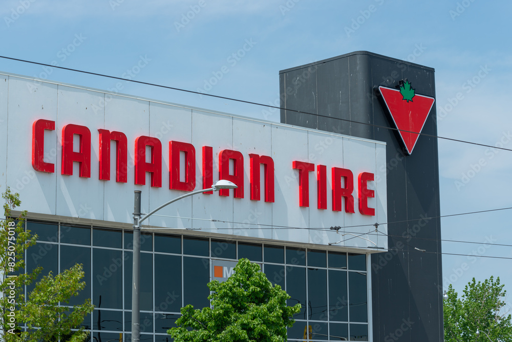 exterior building facade and sign of Canadian Tire, a ubiquitous ...