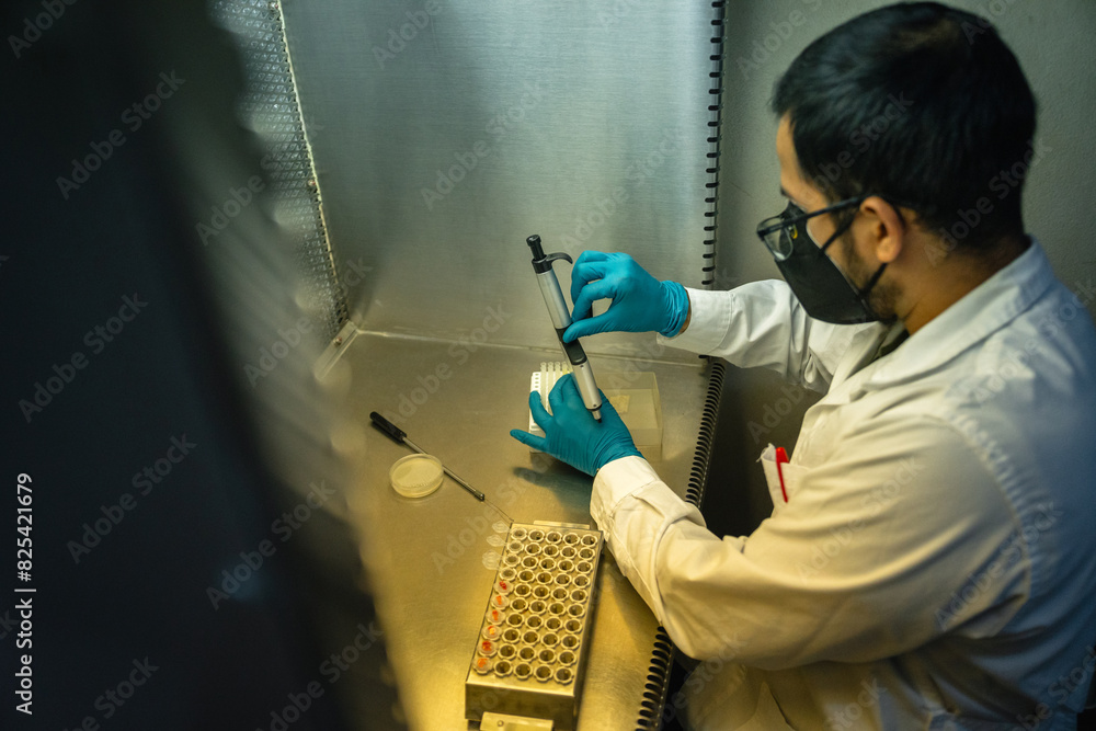 Scientific using multi pipette at laboratory Stock Photo | Adobe Stock