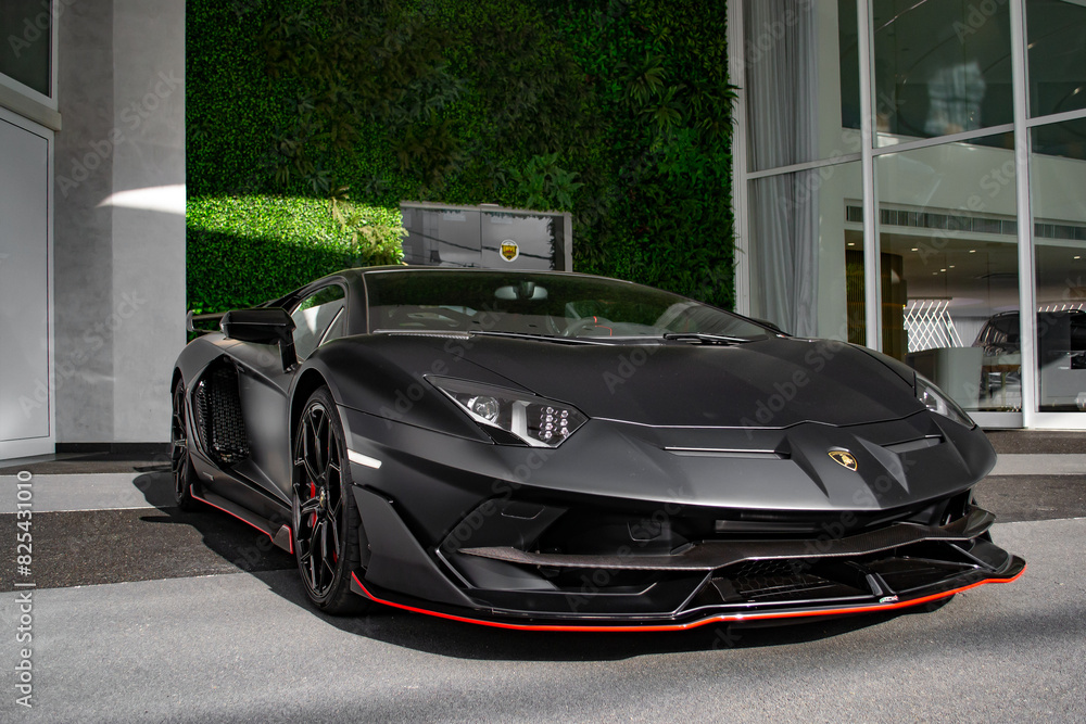 Front end of a satin black Lamborghini Aventador SVJ, low angle ...