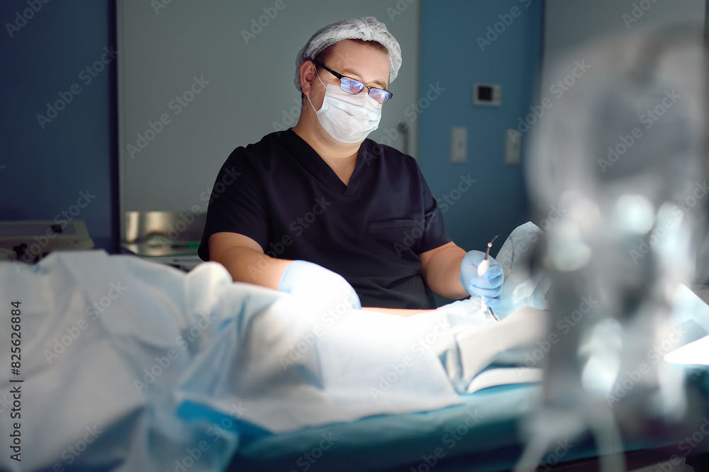 Professional vascular surgeon is in the operating room of the clinic ...