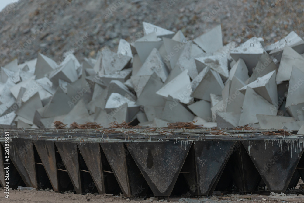 Making dragon teeth for defense. Concrete pyramids. Protection and trap ...