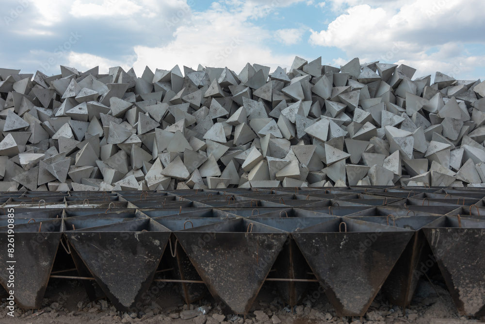 Making dragon teeth for defense. Concrete pyramids. Protection and trap ...