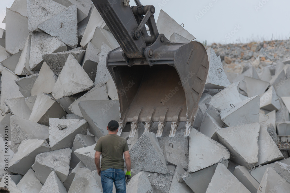Loading and transporting dragon teeth for defense. Concrete pyramids ...