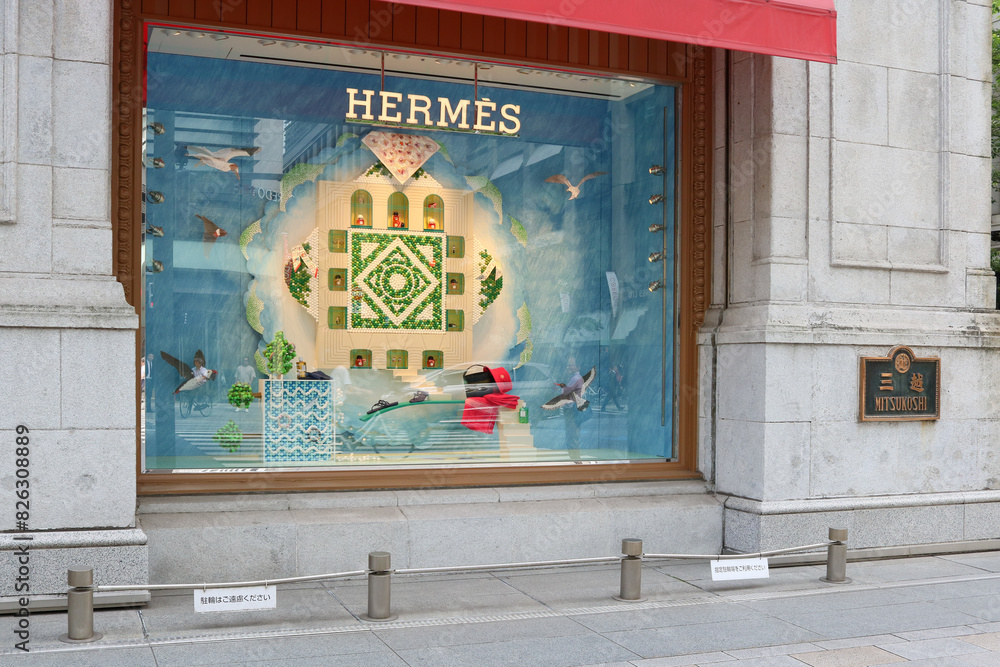 TOKYO, JAPAN - May 23, 2024: A Hermes store window display in ...