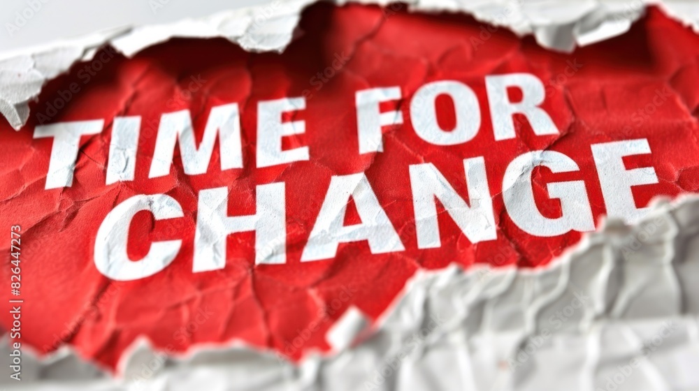 A torn piece of paper with handwritten words time for change. The paper ...