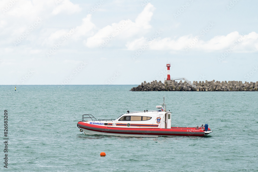 Large boat of the Russian rescue service in the Black Sea. Speedboat of ...