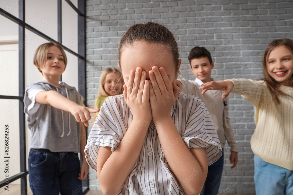 Bullied little girl crying at school, closeup Stock Photo | Adobe Stock