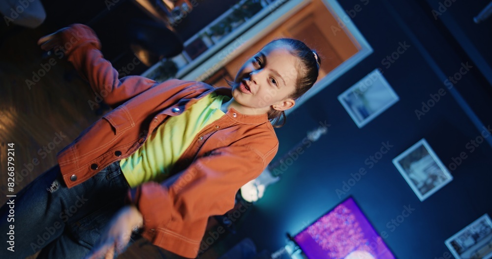 Dutch angle shot on cute girl taking part in trends by sharing content ...