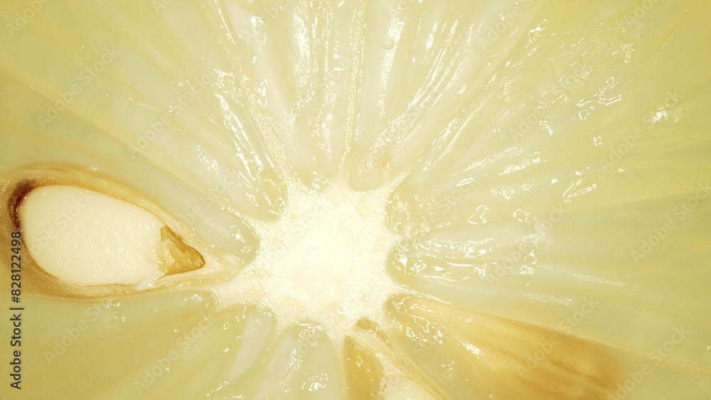 The macro photography of a sliced fresh lemon with vibrant yellow color ...