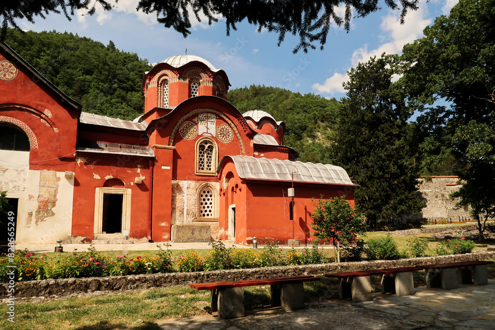 View onto the front facade and roof, domes, cupolas of the bright red ...