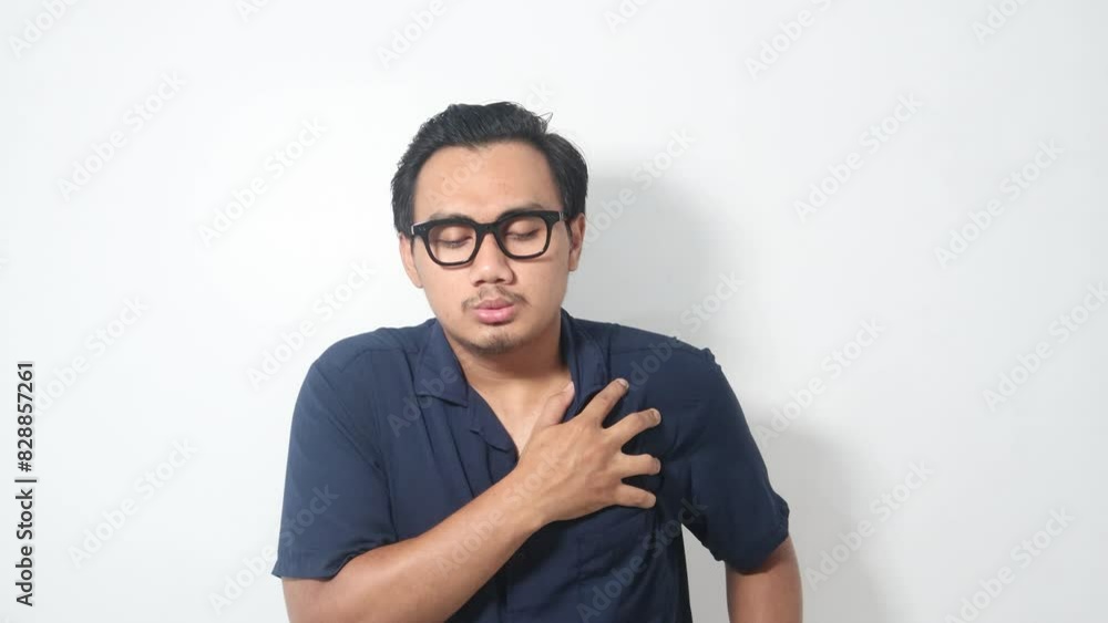 Vidéo Stock Footage of Asian man touching chest feeling sudden acute ...