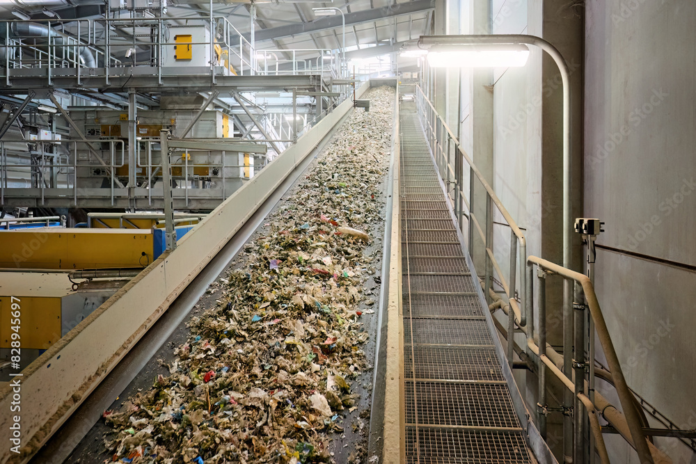 Conveyor belt transporting refuse-derived fuel (RDF) with motion blur ...