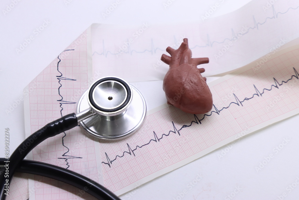 3d printed heart organ above a ekg exam and a stethoscope Stock Photo ...