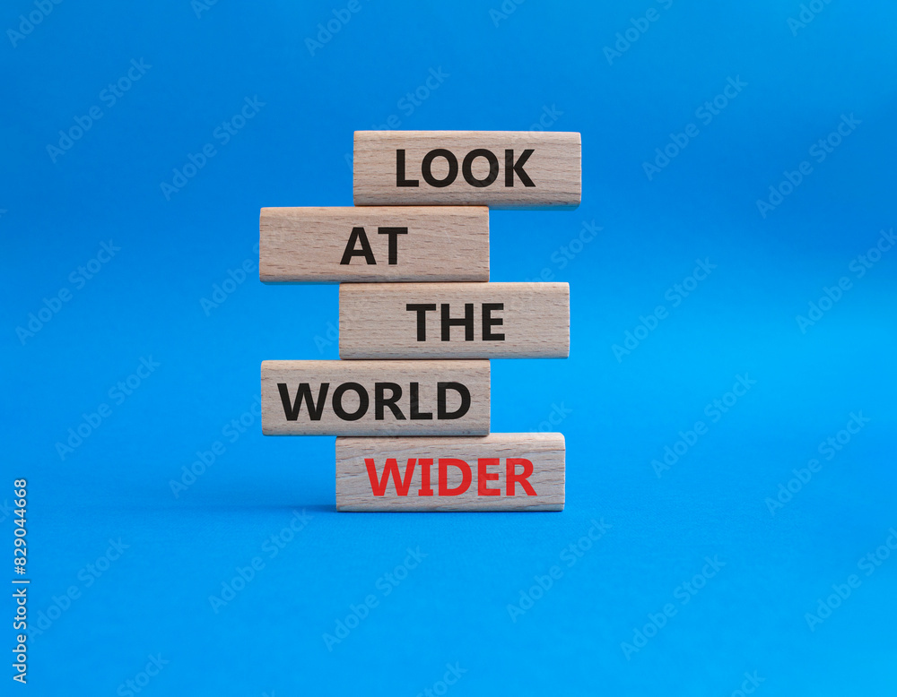 Look at the world wider symbol. Wooden blocks with words Look at the ...