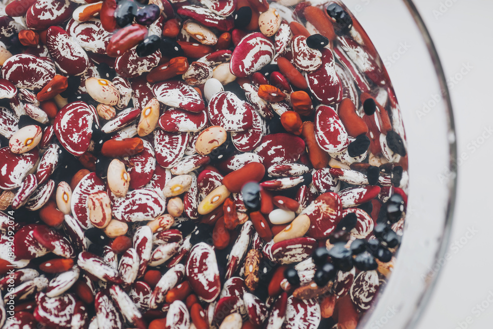 Many strew motley haricot beans under water,. Beans variety. different ...