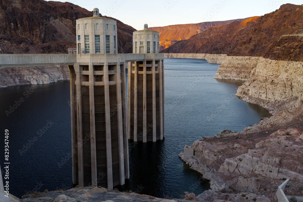 Hoover Dam intake towers and Lake Meade reservoir shown at dusk. Recent ...