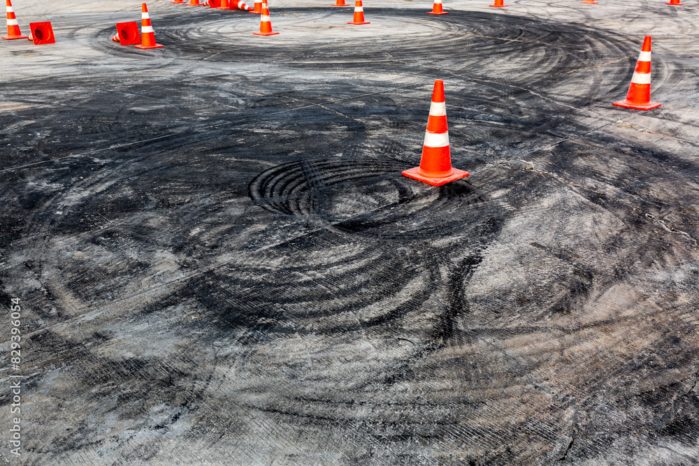 Race track road with tire mark skid road Backgroundn and traffic cone ...