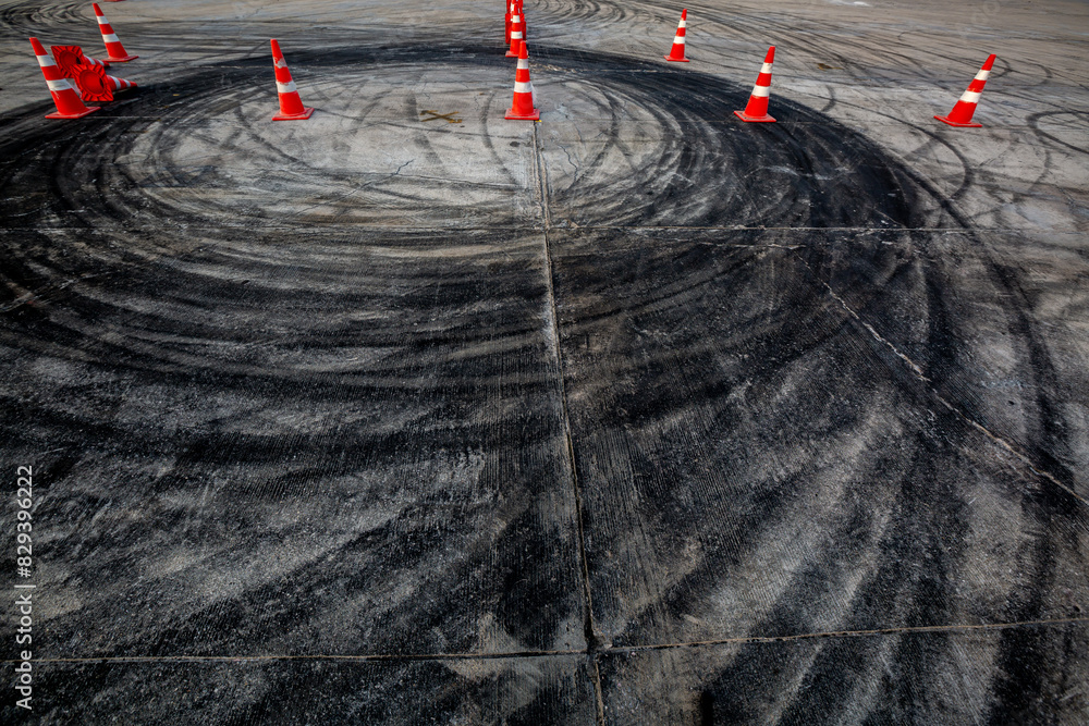 Race track road with tire mark skid road Backgroundn and traffic cone ...