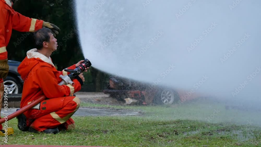 Firefighter Rescue team training in fire fighting extinguisher ...