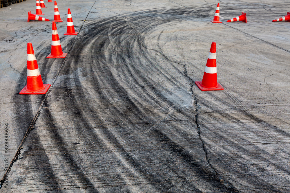 Race track road with tire mark skid road Backgroundn and traffic cone ...