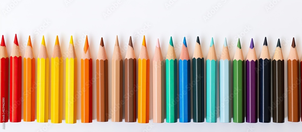 Colored pencils on the white paper book background with vintage style ...