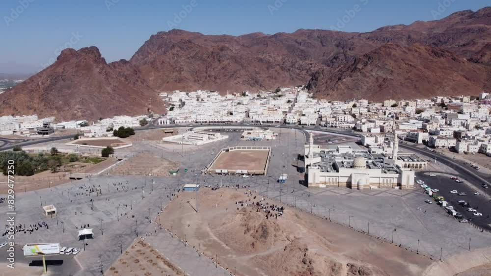 Drone Shot of the Uhud Mountain and the Settlement with a Mosque at the ...