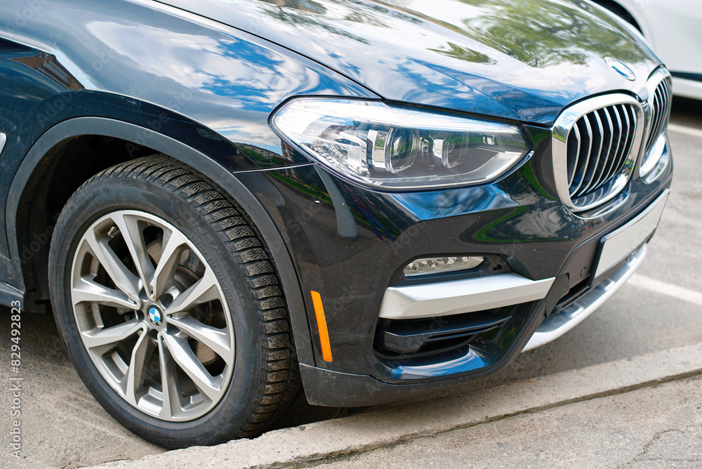 Minsk, Belarus. Apr 22, 2024. BMW X5 parked close to the curb, side ...