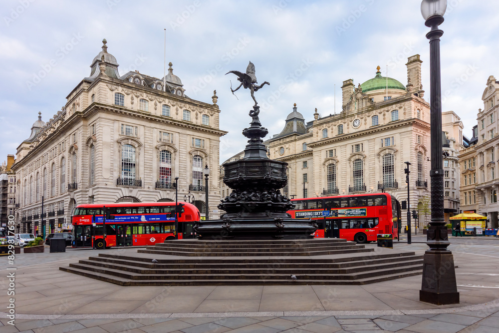 Statue of Eros and double-decker buses on Piccadilly circus, London, UK ...