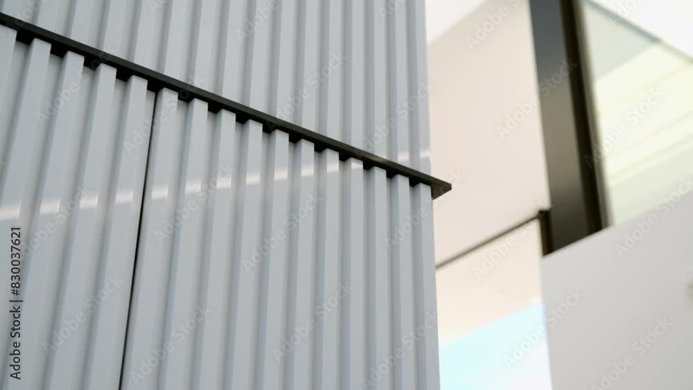 Close up view of modern building exterior featuring metal construction ...