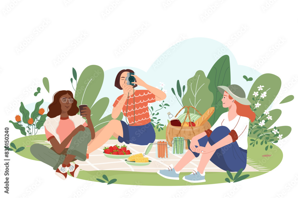 Girls at picnic in the park. Different skin type young women eating ...
