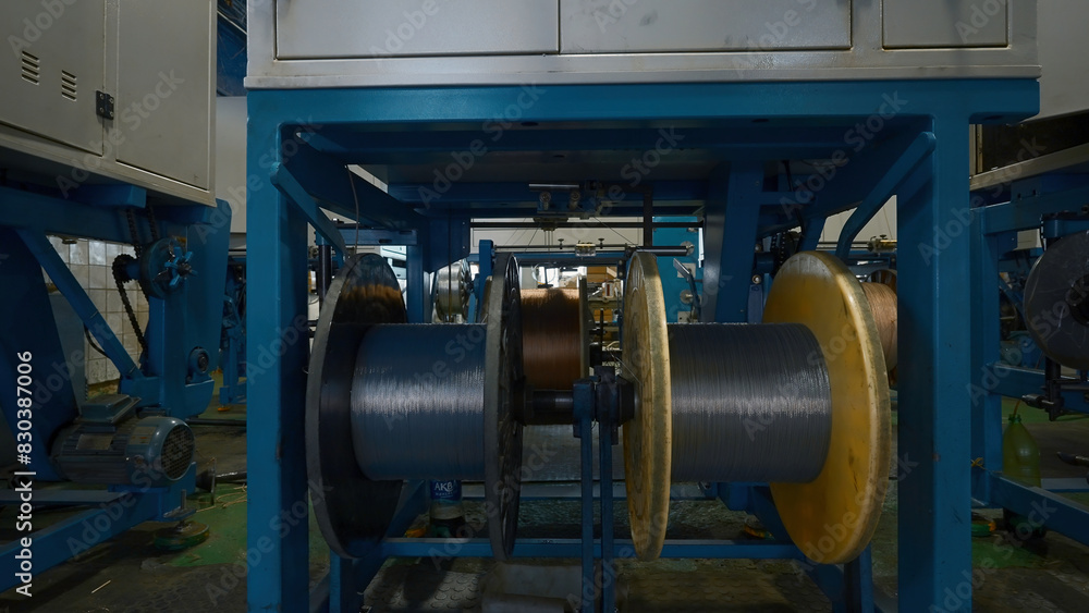 Rotating coils in industrial enterprise. Creative. Process of plastic ...