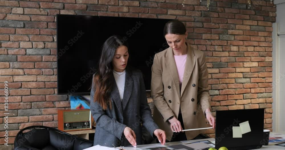 Team of merchandisers in a collaborative meeting, planning visual ...