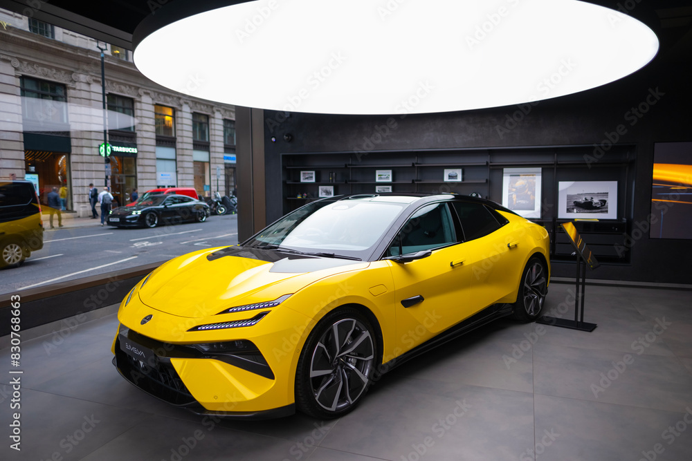 new yellow battery-Electric Hyper-GT Lotus Emeya in showroom, British ...