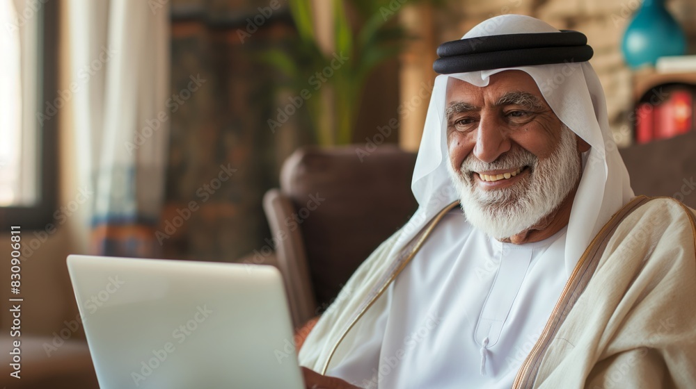 Elderly Middle Eastern Man in Traditional Clothing Using Laptop at Home ...