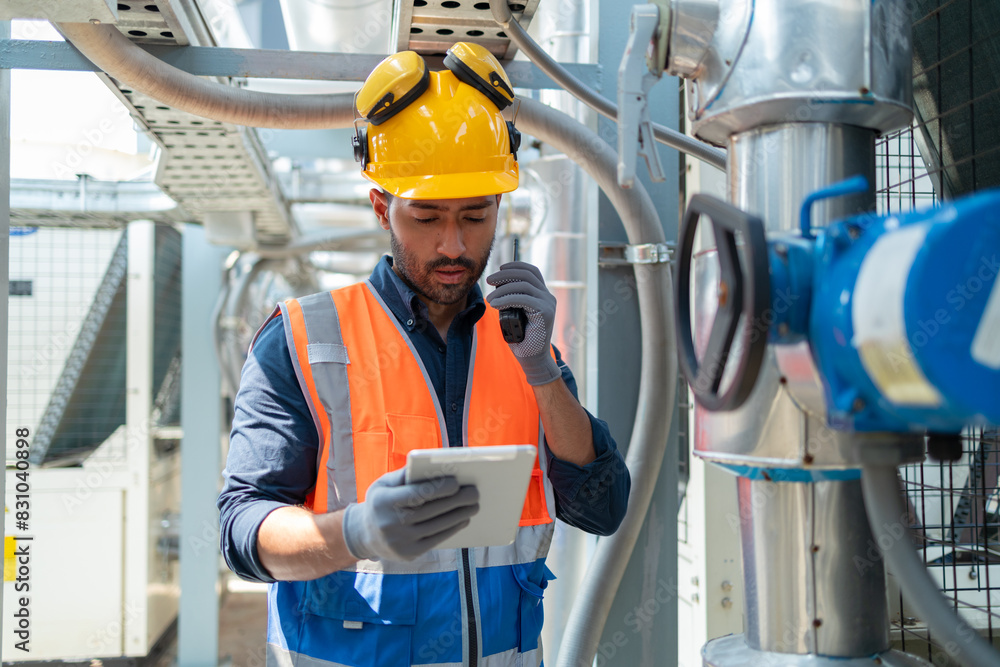 Engineer under checking the industry chilled water fan coil unit air ...