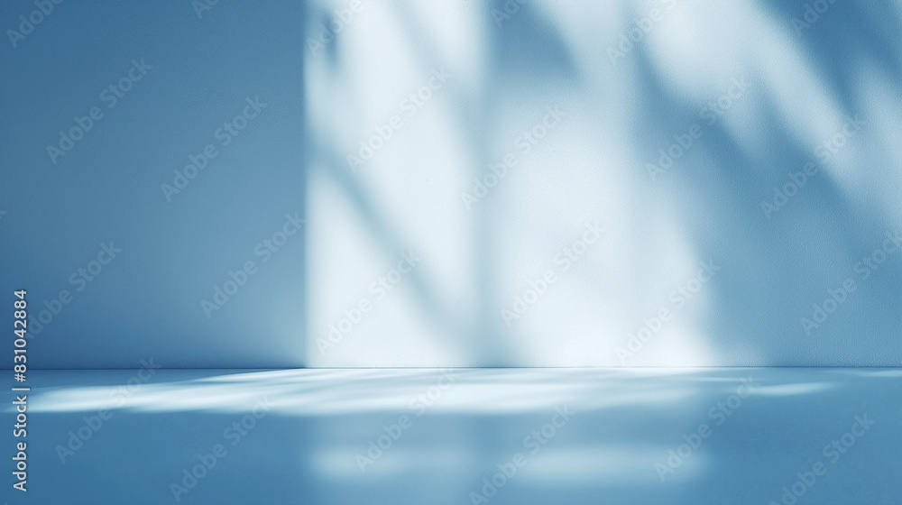 Minimal background with blurred foliage shadow on a light blue wall ...