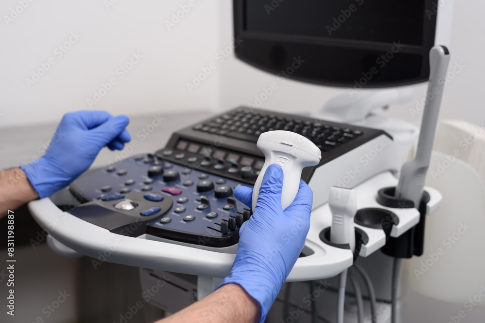 Probe for ultrasound diagnostics close-up. The doctor holds in his ...