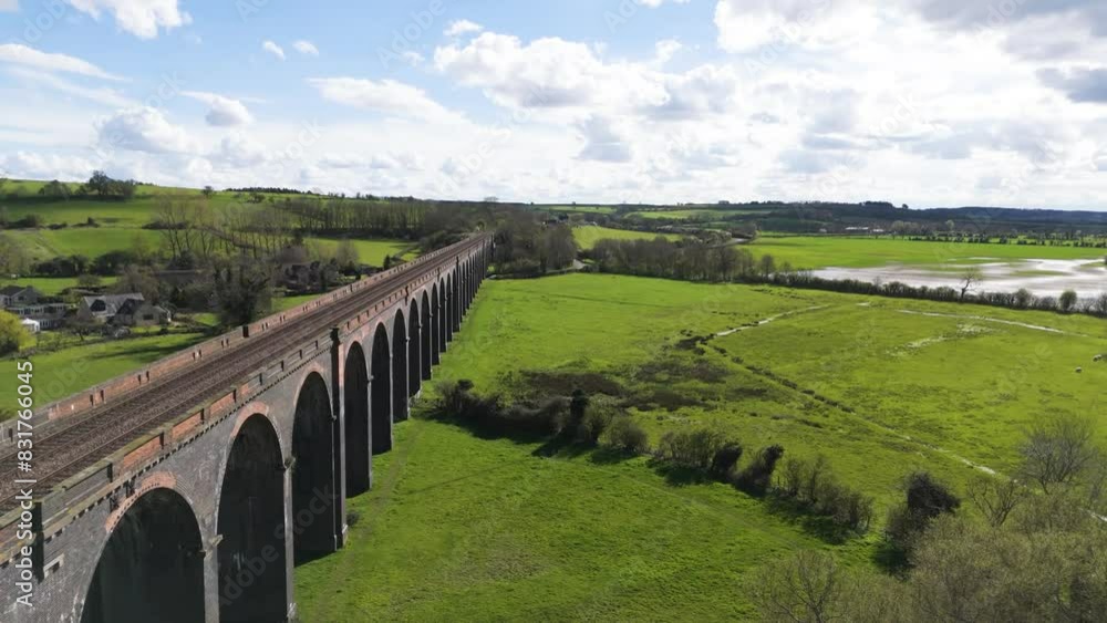 Drone over and dropping alongside the arches of Welland Viaduct ...