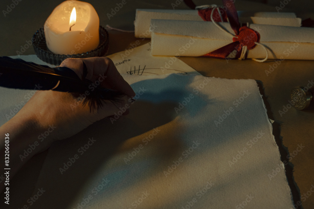 Writing a medieval letter with a black feather quill, illuminated by ...