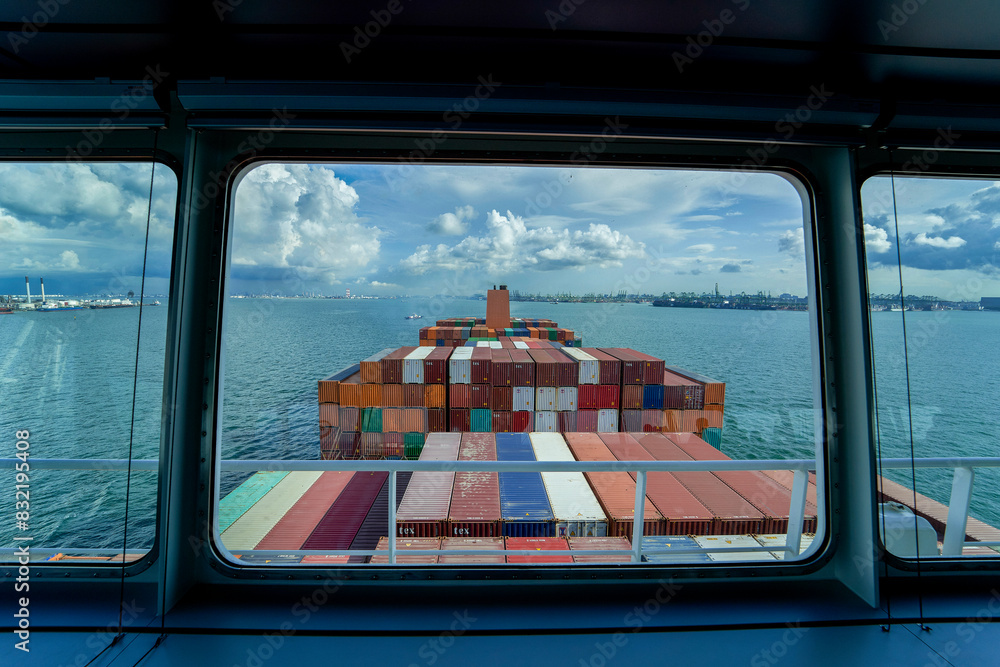 A view from a ship's bridge window overlooking a large stack of ...