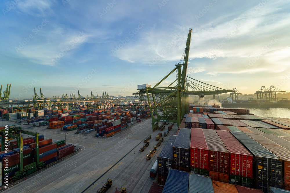 Sunrise over a bustling container port, showcasing rows of colorful ...