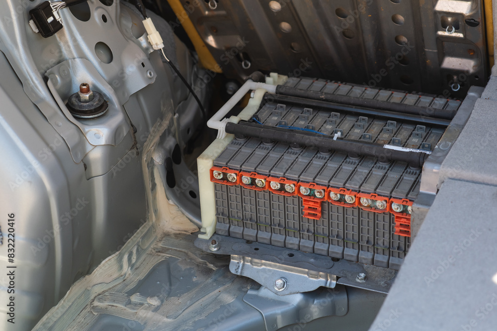 High-voltage traction battery cells installed on a vehicle with a ...