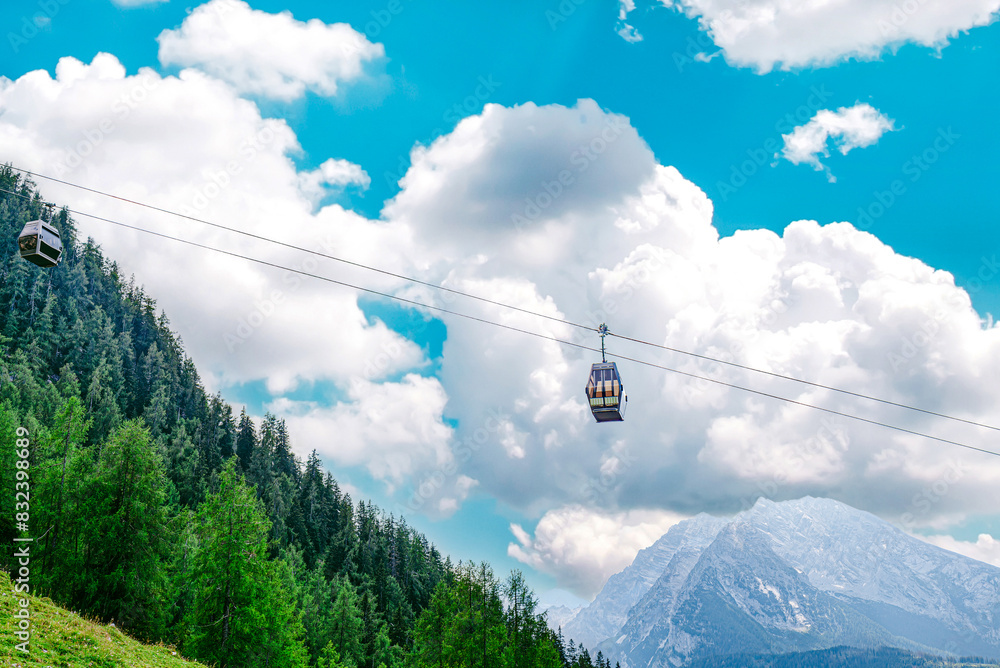 Schönau am Königssee, Bavaria, Jennerbahn. Cable car against blue cloud ...