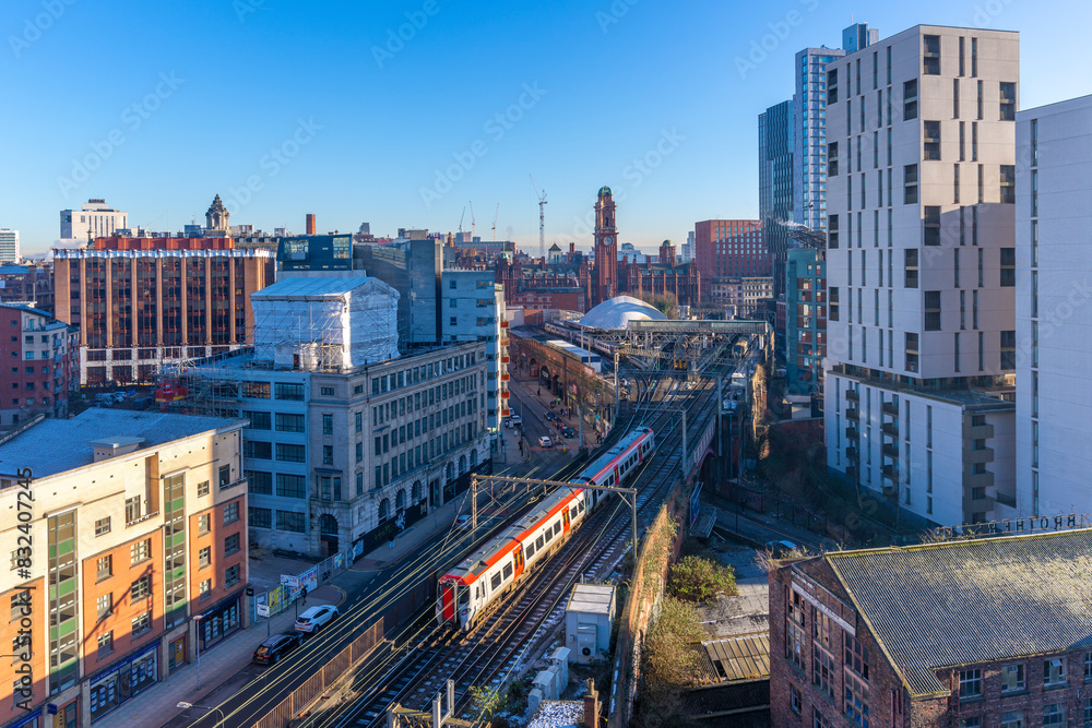 Elevated view of city skyline from Tony Wilson Place, Manchester ...